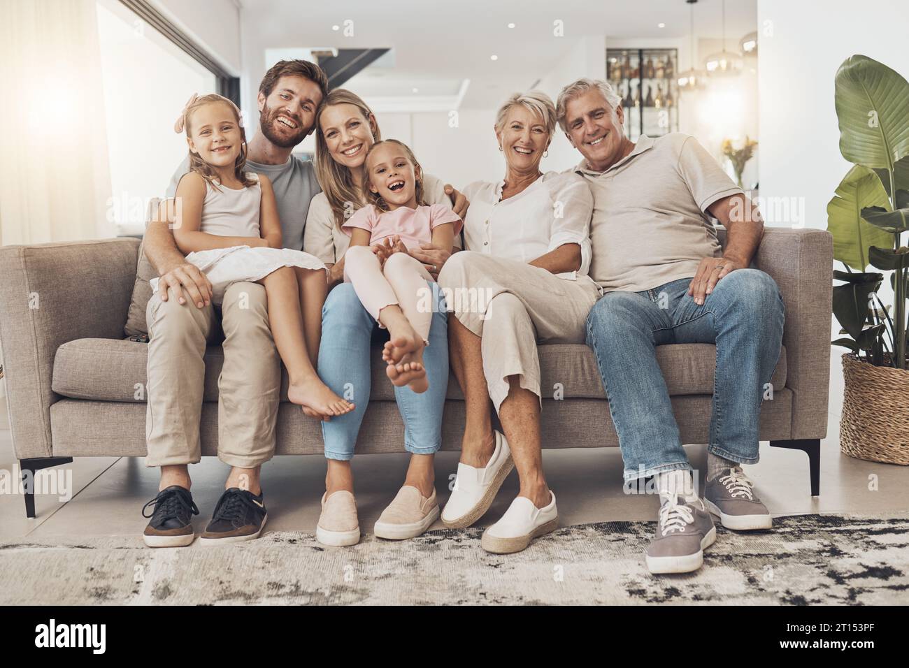 Big family, happy and portrait in home living room, support and bonding ...