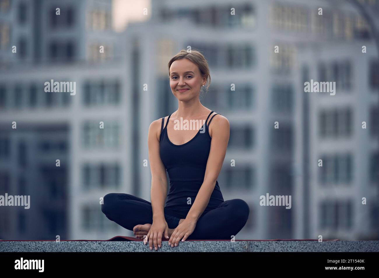 Beautiful young woman practices yoga asana Sukhasana - The Easy Sitting ...