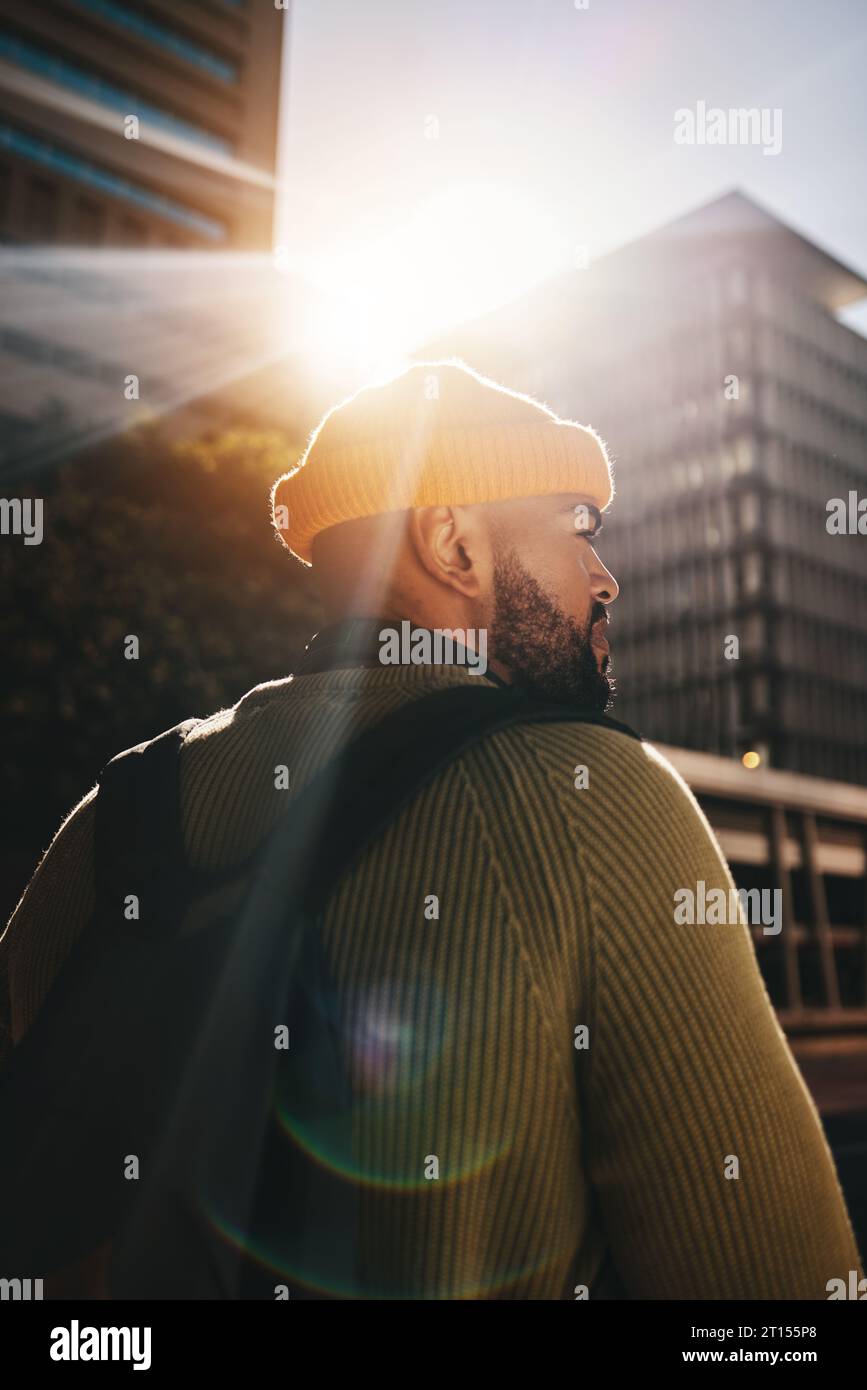 Back, thinking and man in a city, fashion and lens flare with ideas ...