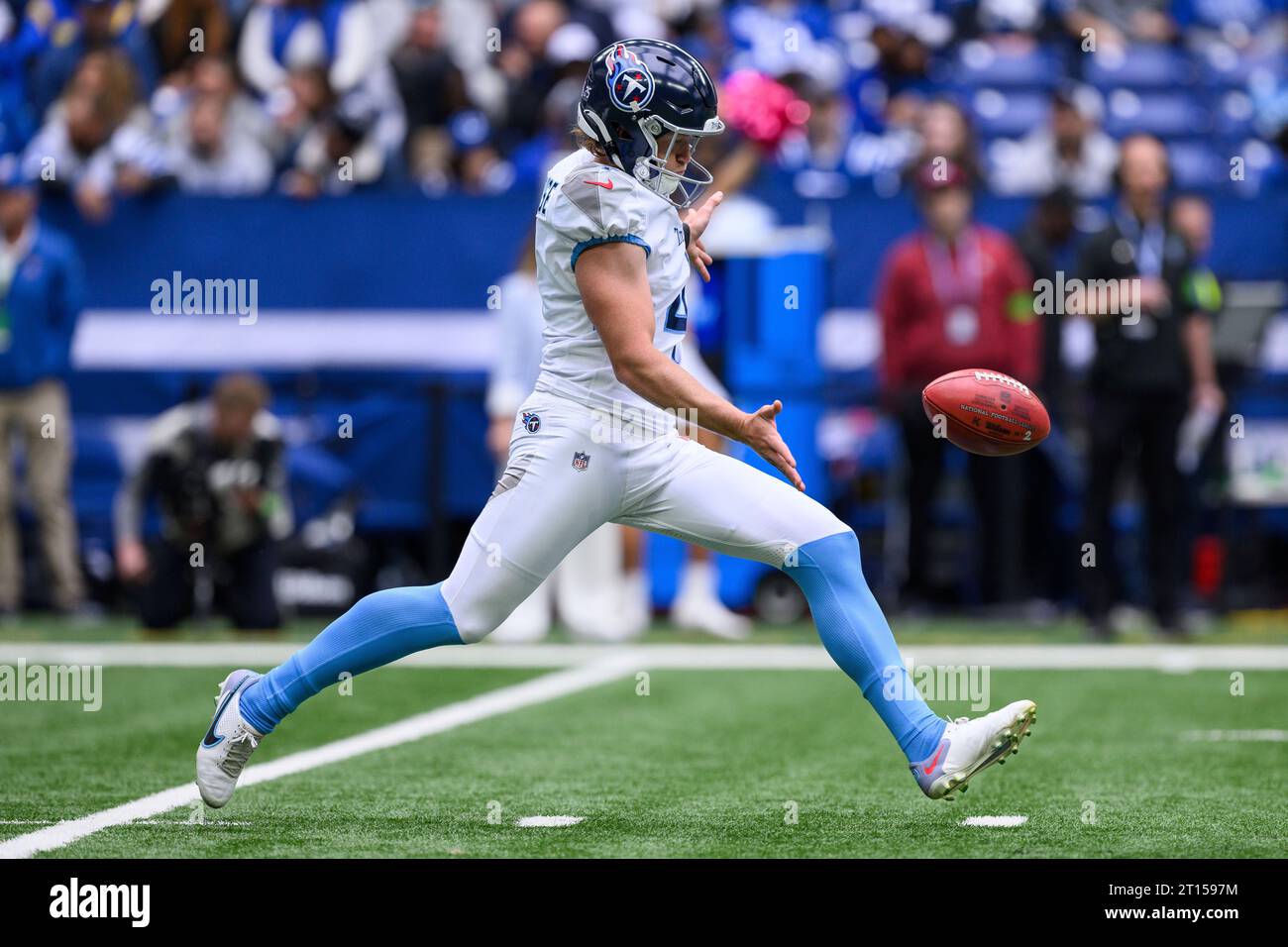 Tennessee Titans punter Ryan Stonehouse (4) punts downfield during an ...