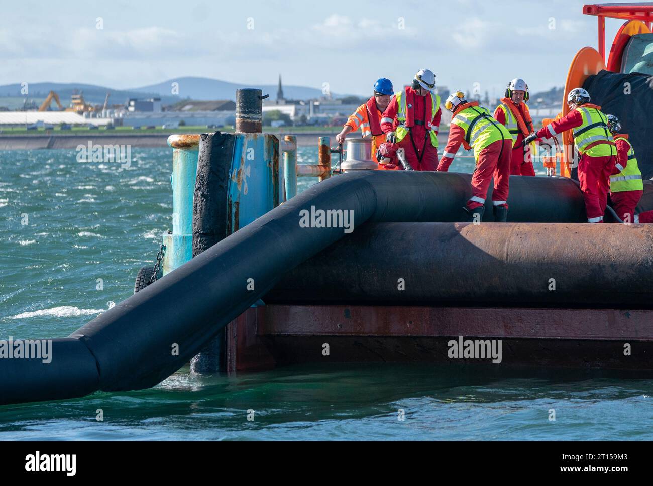 Crew onboard the Jif Worker, a multi-cat vessel, deploy a heavy duty ...