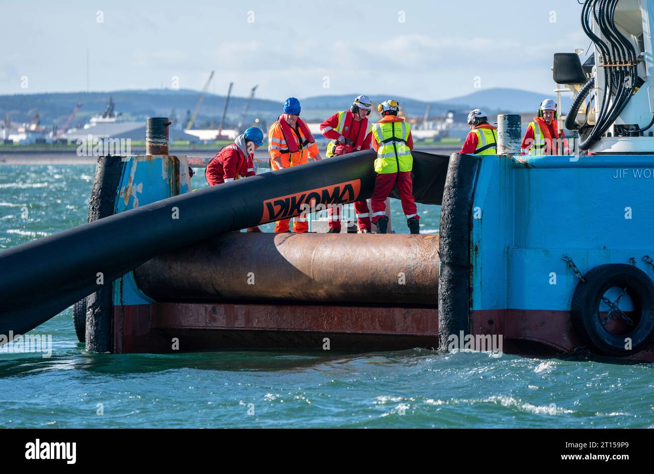 Crew onboard the Jif Worker, a multi-cat vessel, deploy a heavy duty ...