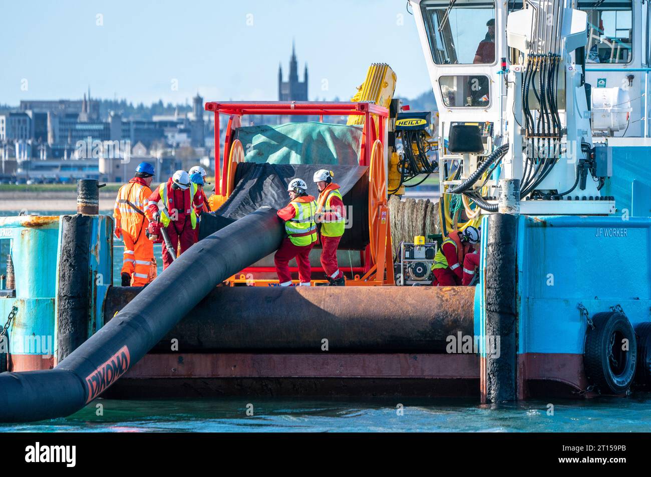 Crew onboard the Jif Worker, a multi-cat vessel, deploy a heavy duty ...