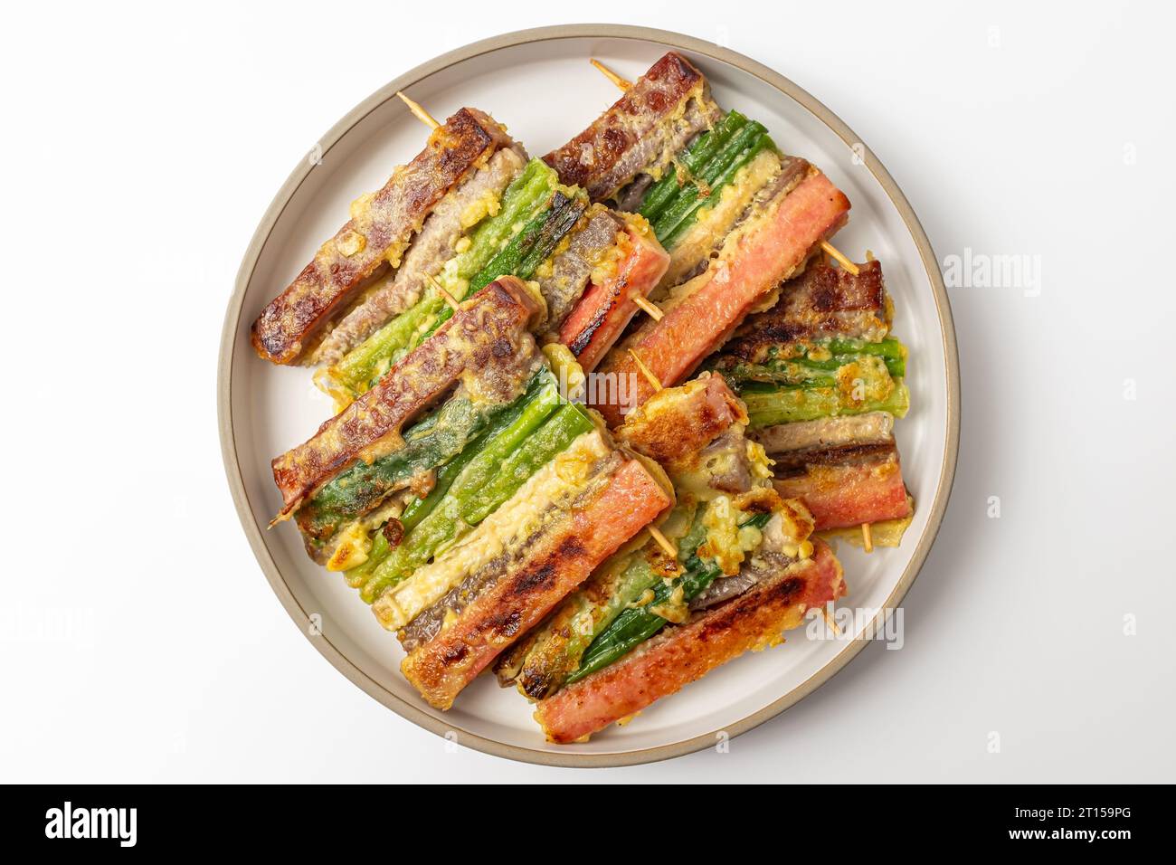 Korean holiday food skewers Jeon on white background Stock Photo - Alamy