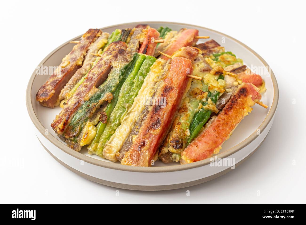 Korean holiday food skewers Jeon on white background Stock Photo - Alamy