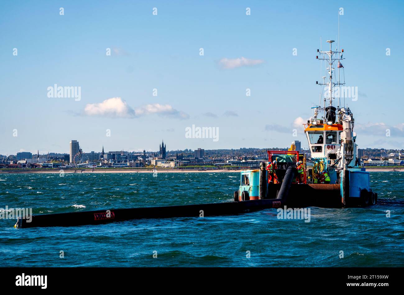 Crew onboard the Jif Worker, a multi-cat vessel, deploy a heavy duty ...