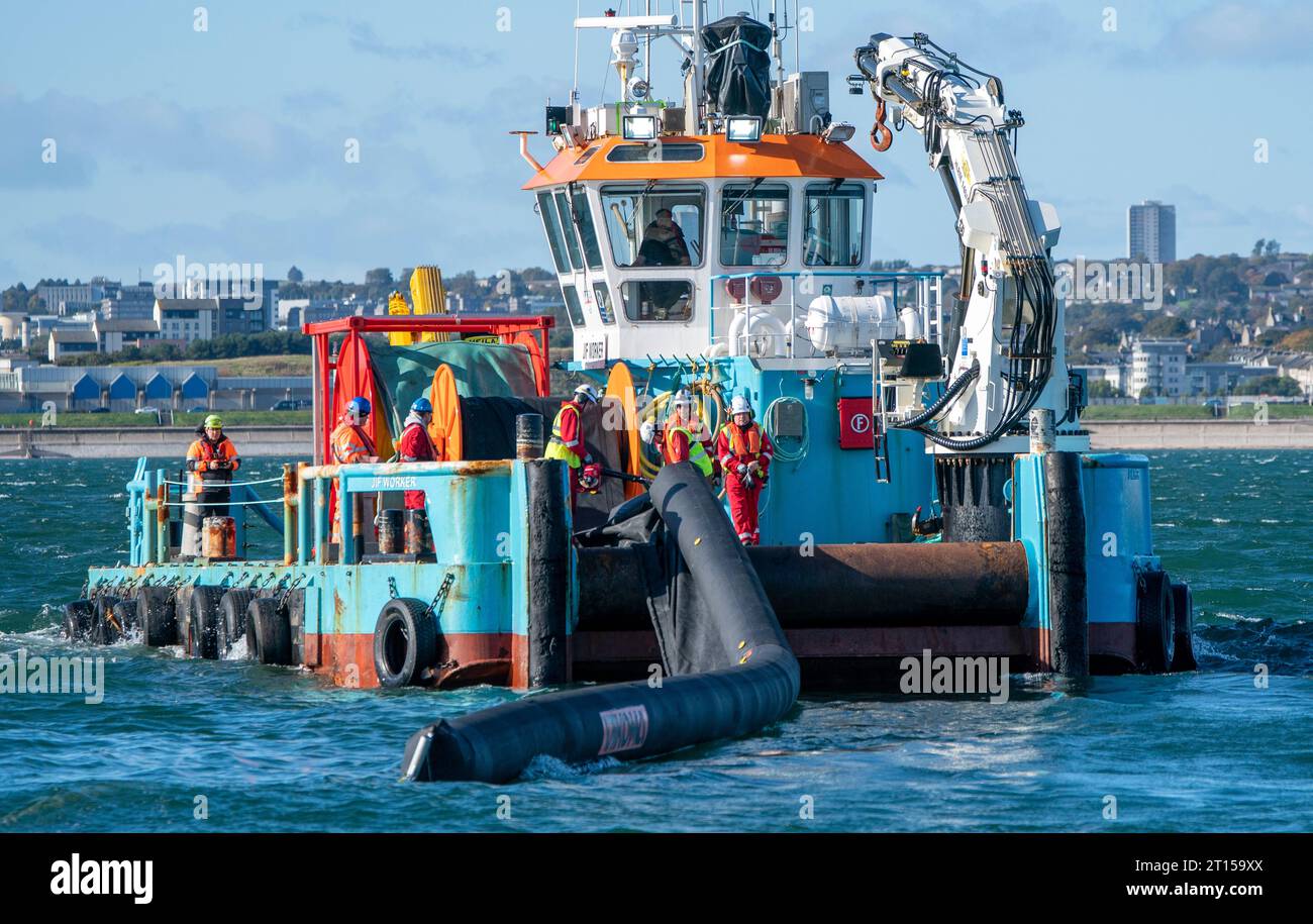 Crew onboard the Jif Worker, a multi-cat vessel, deploy a heavy duty ...