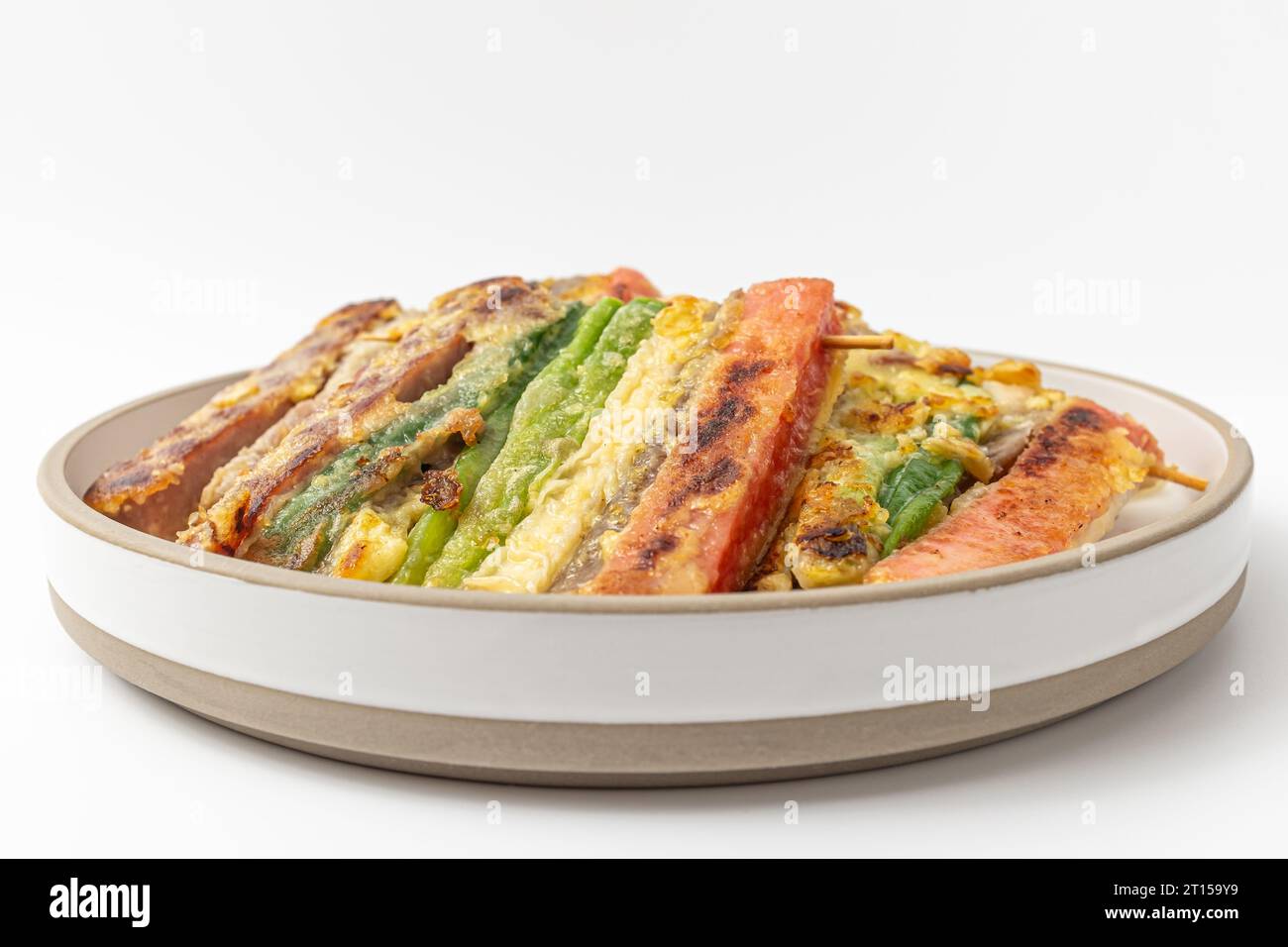 Korean holiday food skewers Jeon on white background Stock Photo - Alamy