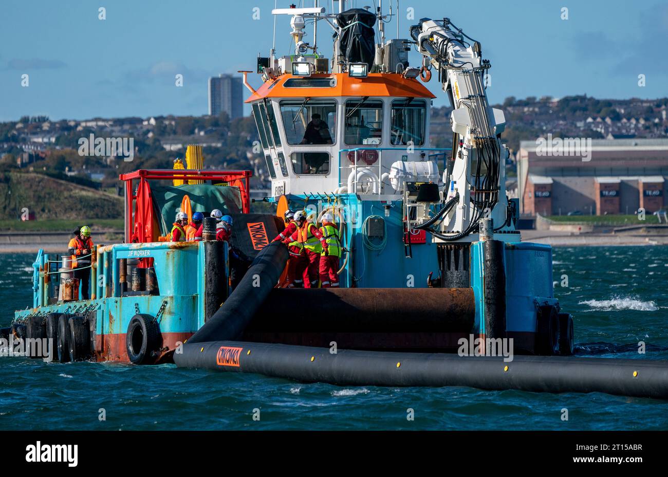 Crew onboard the Jif Worker, a multi-cat vessel, deploy a heavy duty ...