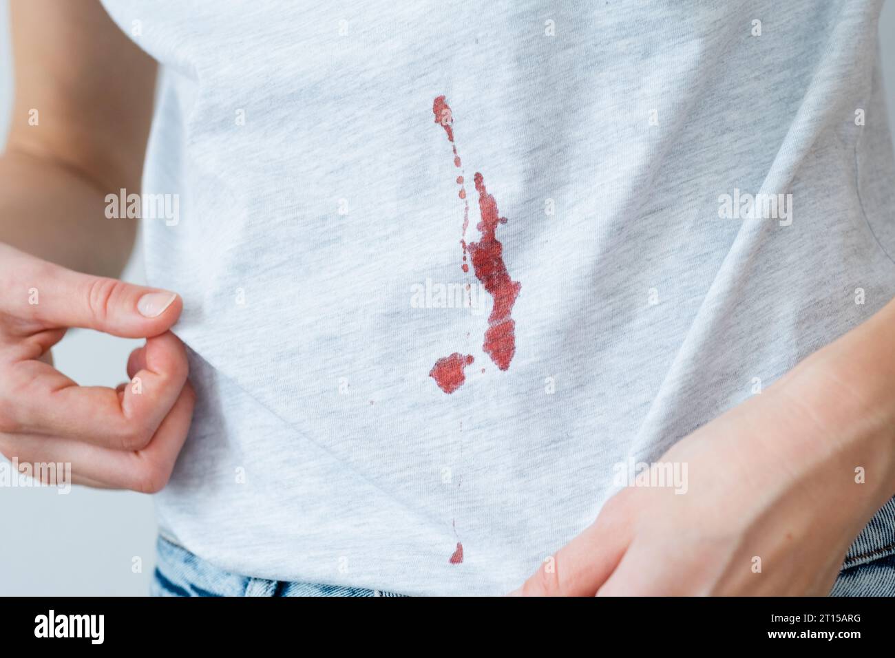 Drop stain of blood on a white t-shirt. daily life stain concept Stock ...