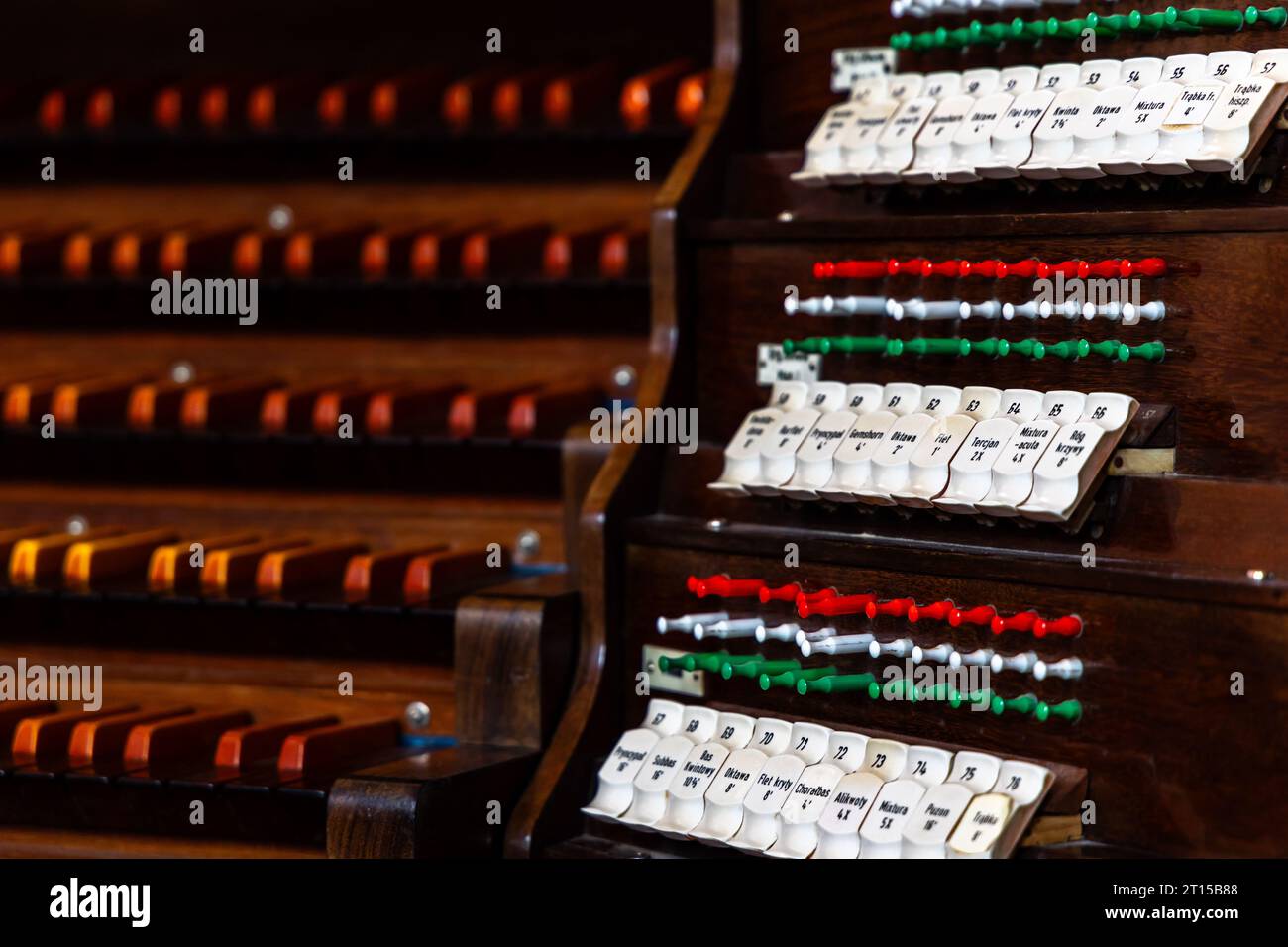 Wooden keyboard of an antique church pipe organ. The photo was taken in ...