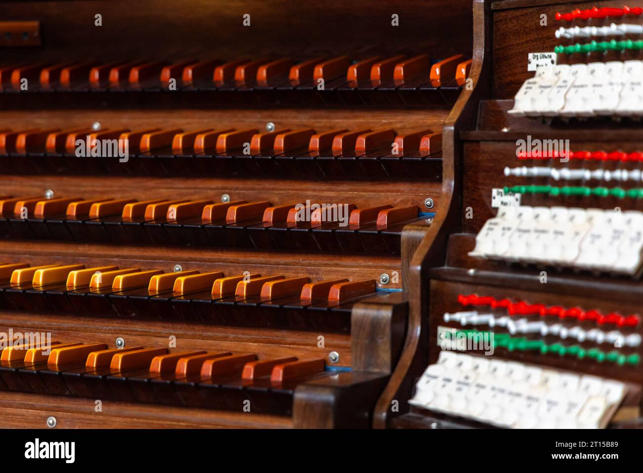 Wooden keyboard of an antique church pipe organ. The photo was taken in ...