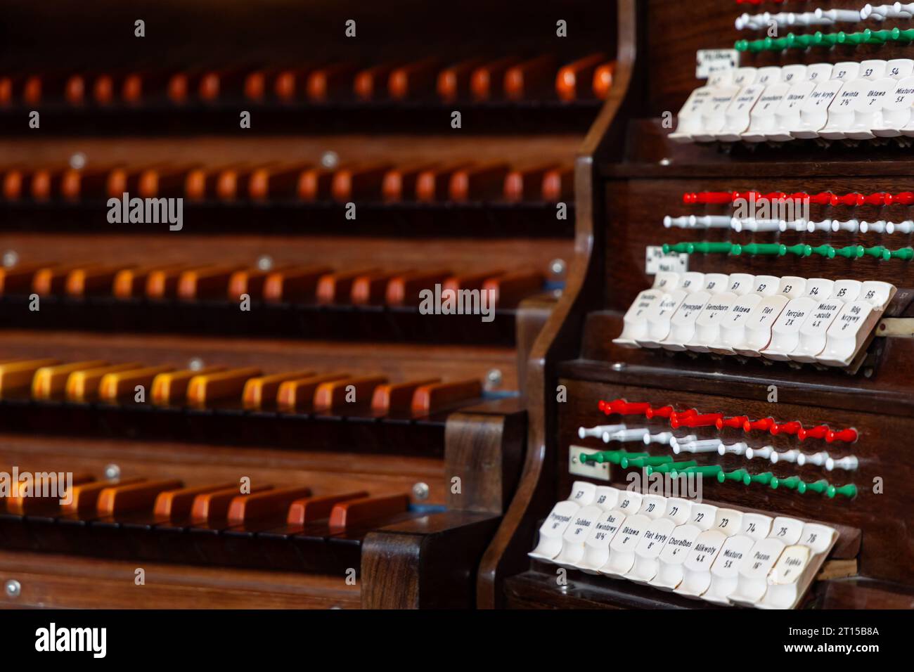 Wooden keyboard of an antique church pipe organ. The photo was taken in ...