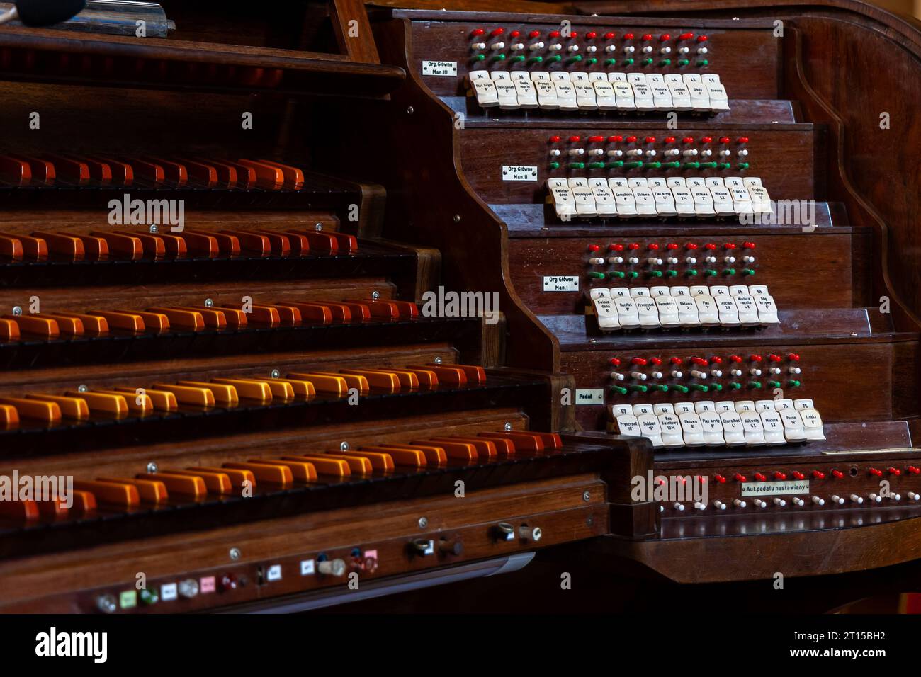 Wooden keyboard of an antique church pipe organ. The photo was taken in ...