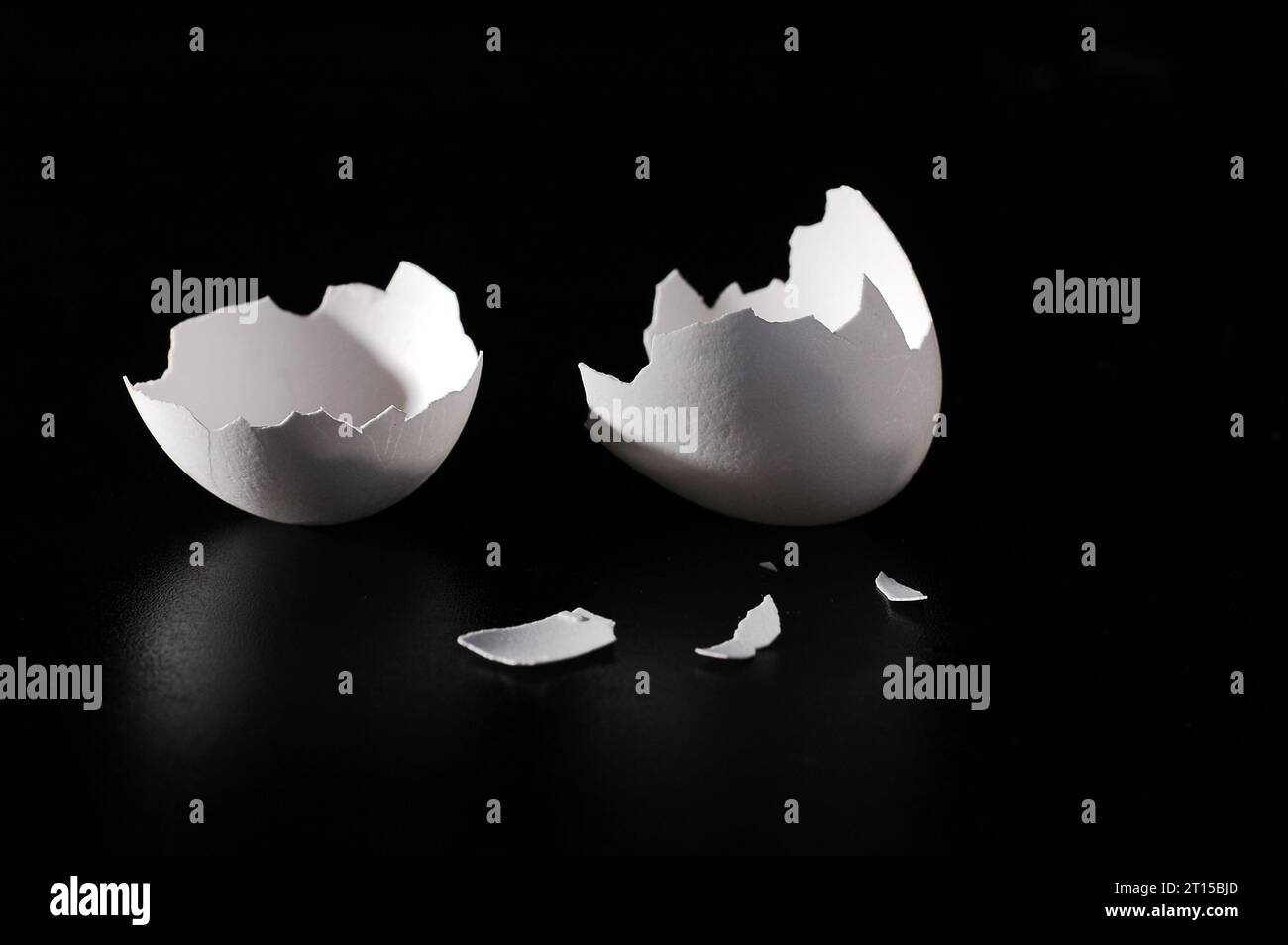 egg shell broken crack on black background Stock Photo - Alamy