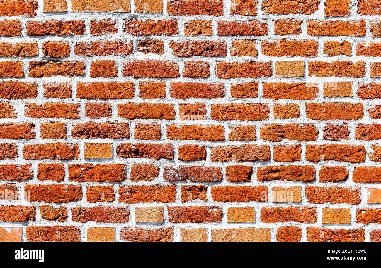 Old weathered red brick wall as creative background. Bricks masonry with seams Stock Photo - Alamy