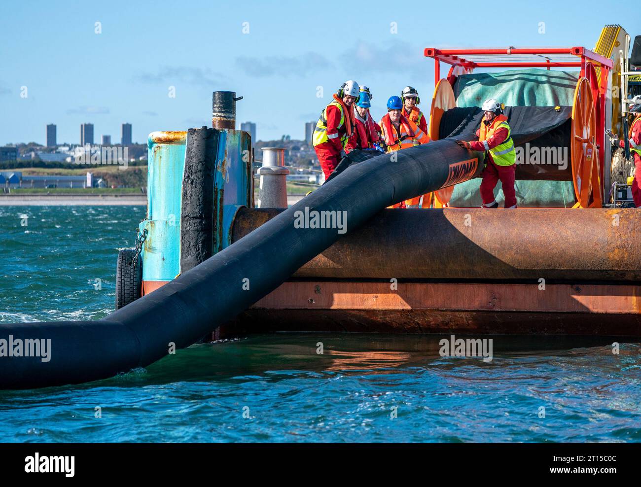 Crew onboard the Jif Worker, a multi-cat vessel, deploy a heavy duty ...