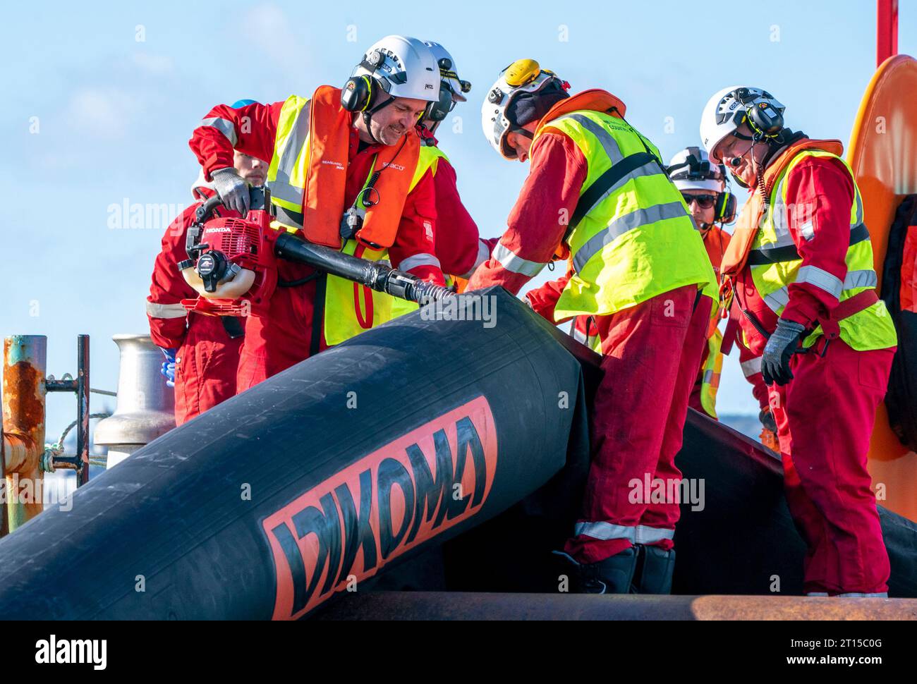 Crew onboard the Jif Worker, a multi-cat vessel, deploy a heavy duty ...