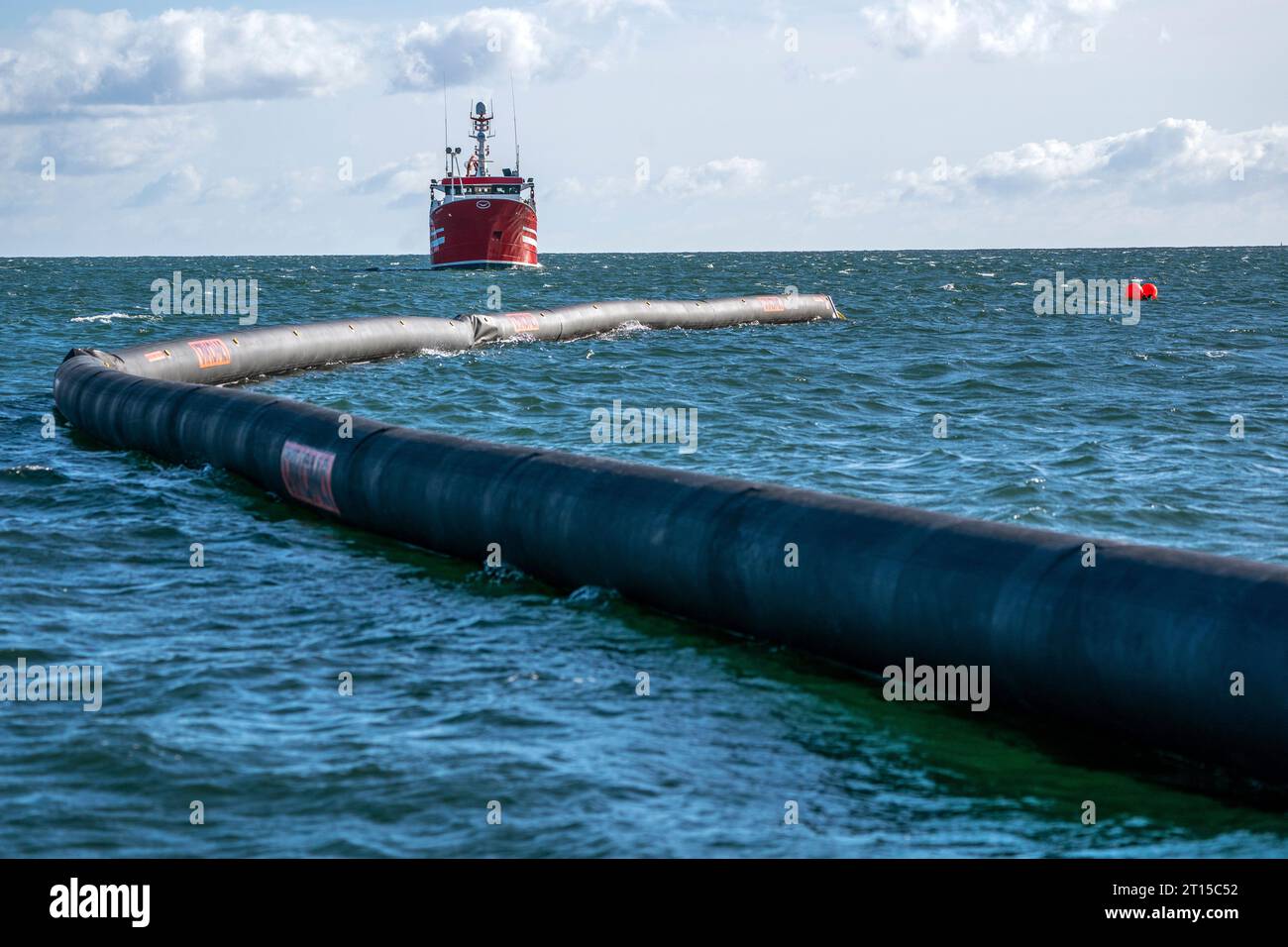 A heavy duty ocean boom and a response vessel in the Port of Aberdeen ...