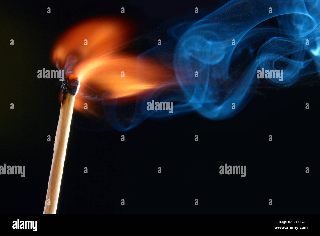 Match with smoke and fire on black background Stock Photo - Alamy