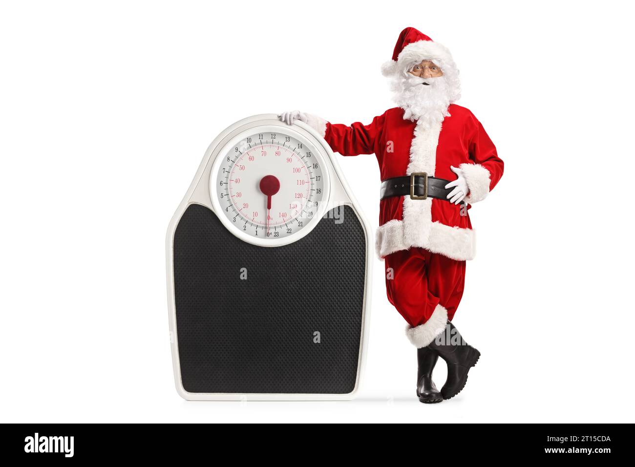 Santa Claus leaning on a big weight scale isolated on white background ...