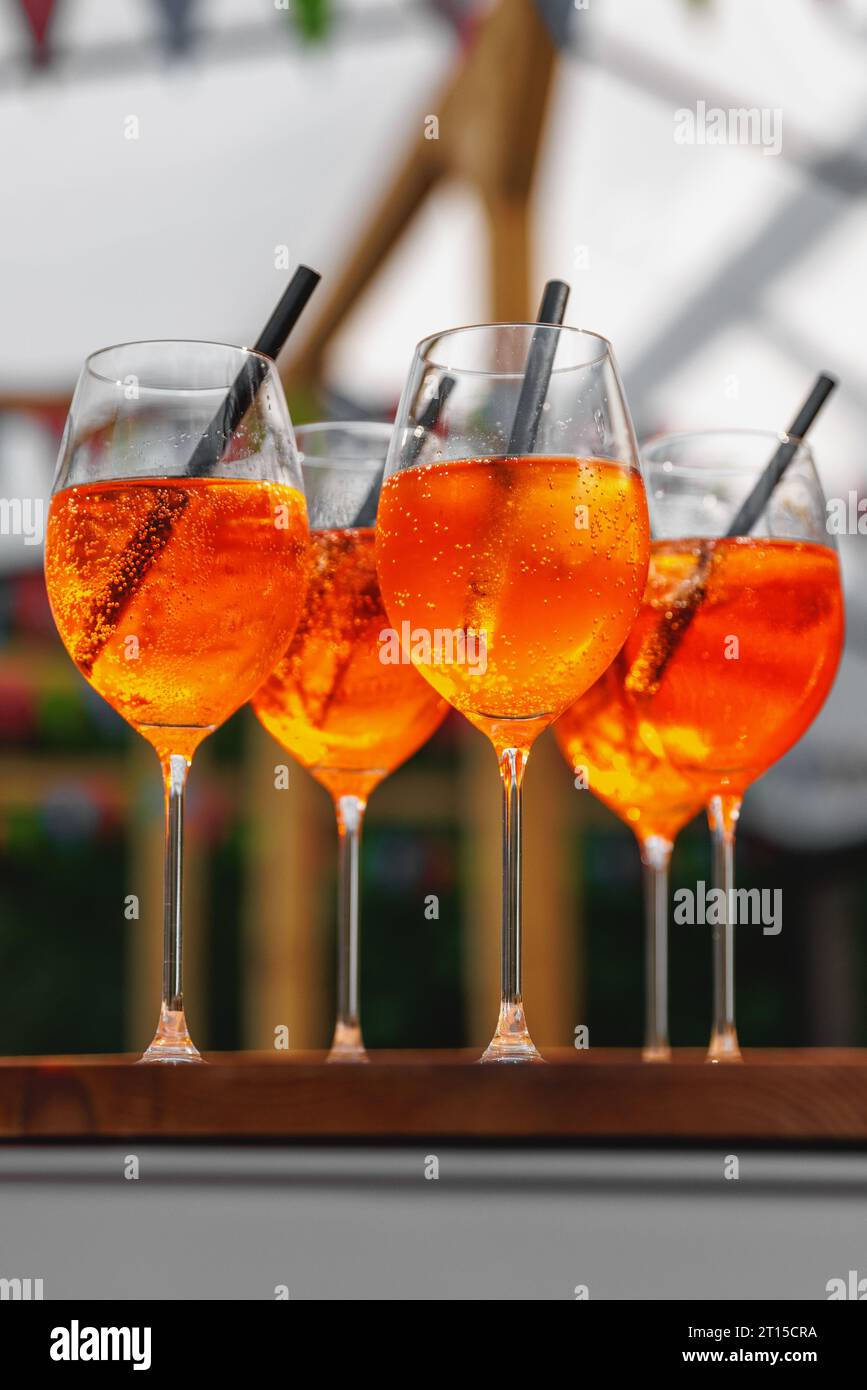 The row of glasses with Aperol Spritz summer cocktail Stock Photo - Alamy