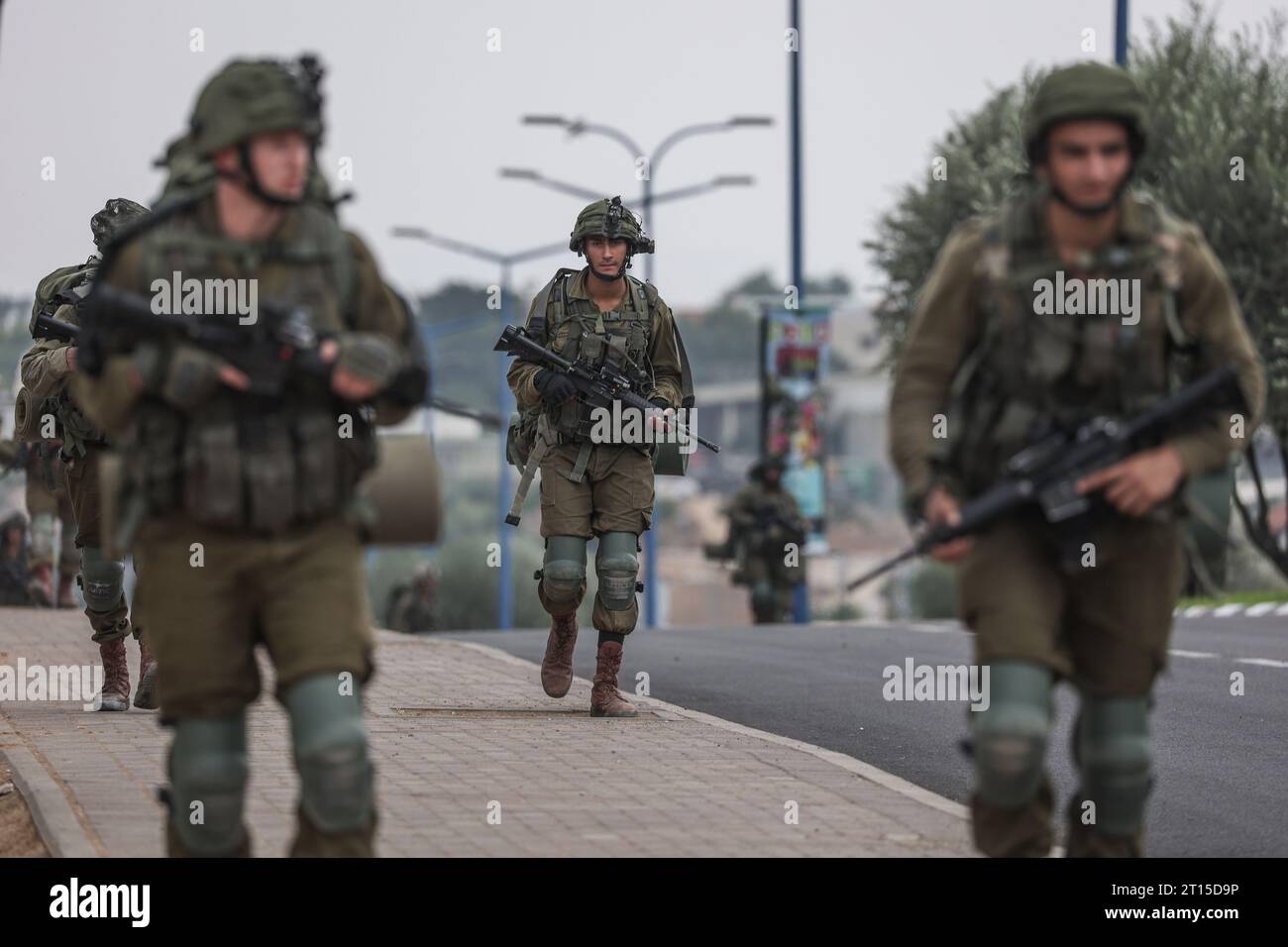 11 October 2023, Israel, Sderot: Israeli officers secure the area as ...