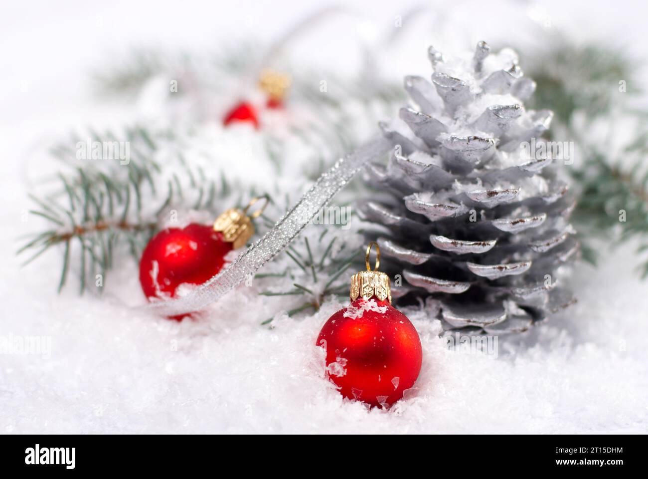 Christmas beautiful red balls with fir branch, pine cone and snow on ...