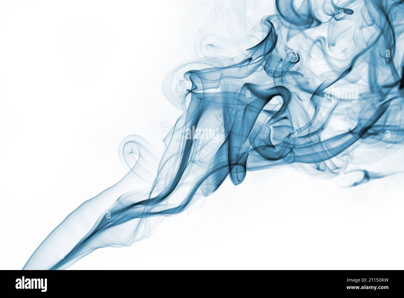 Blue abstract smoke from the aromatic sticks on a white background ...