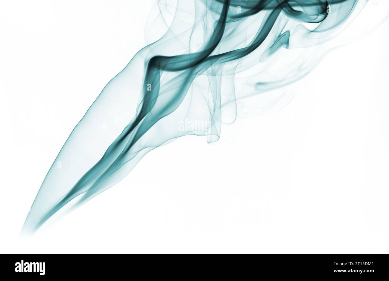 Green abstract smoke from the aromatic sticks on a white background ...