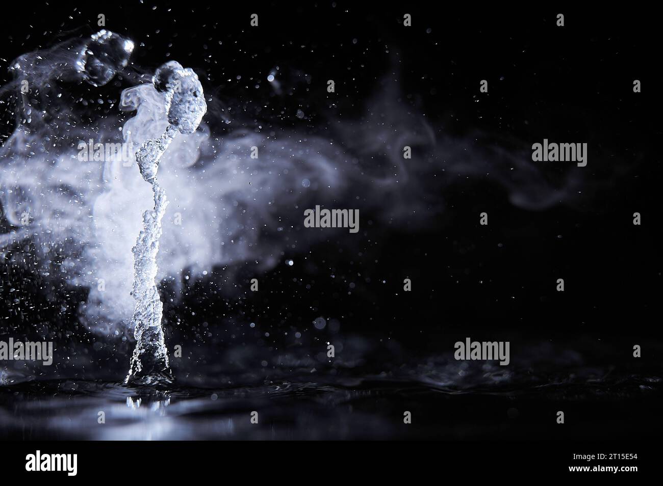 Boiling water splash with steam on black background closeup Stock Photo ...