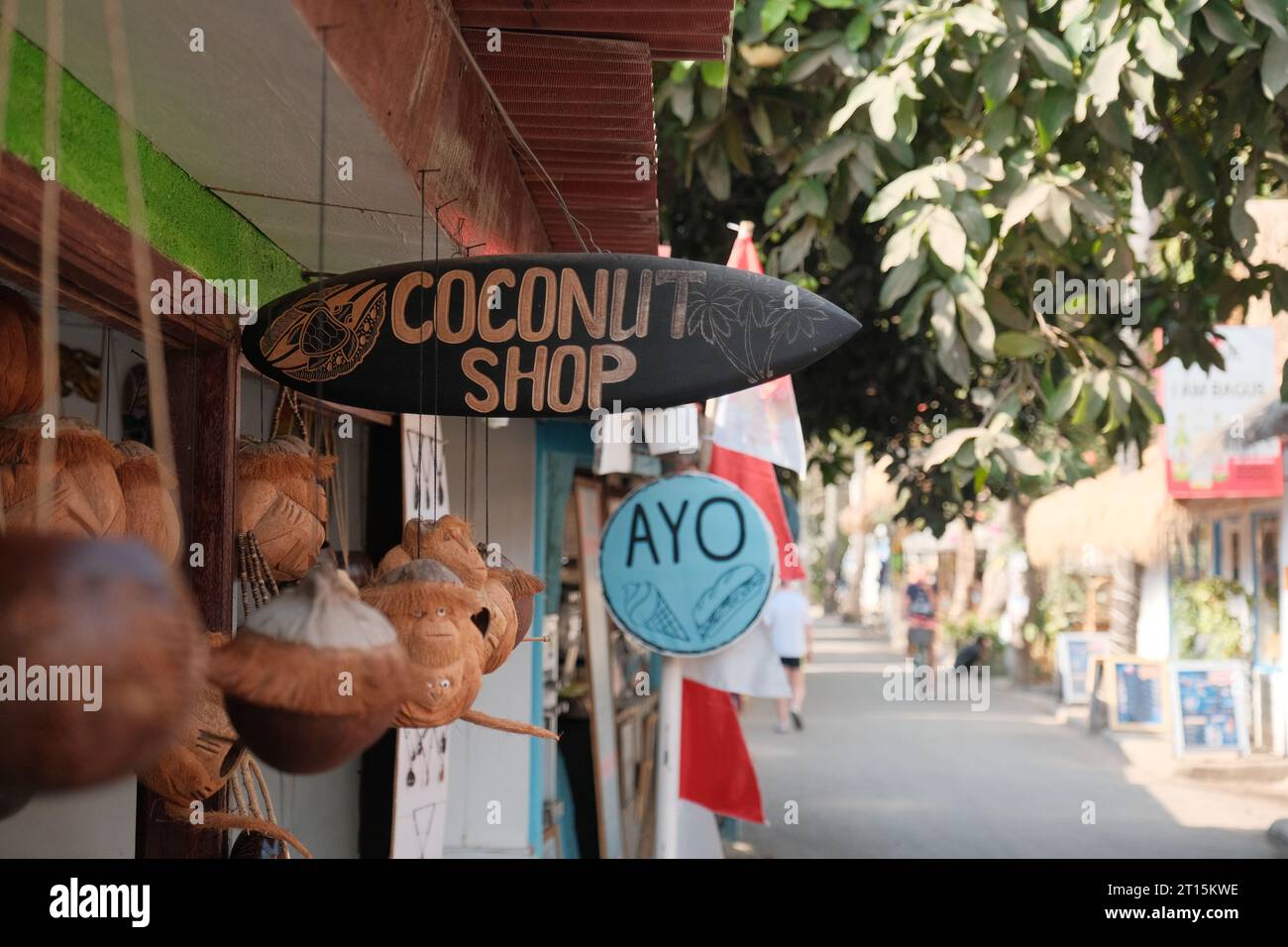 Strolling along the vibrant promenade of the Gili Islands, shop signs ...