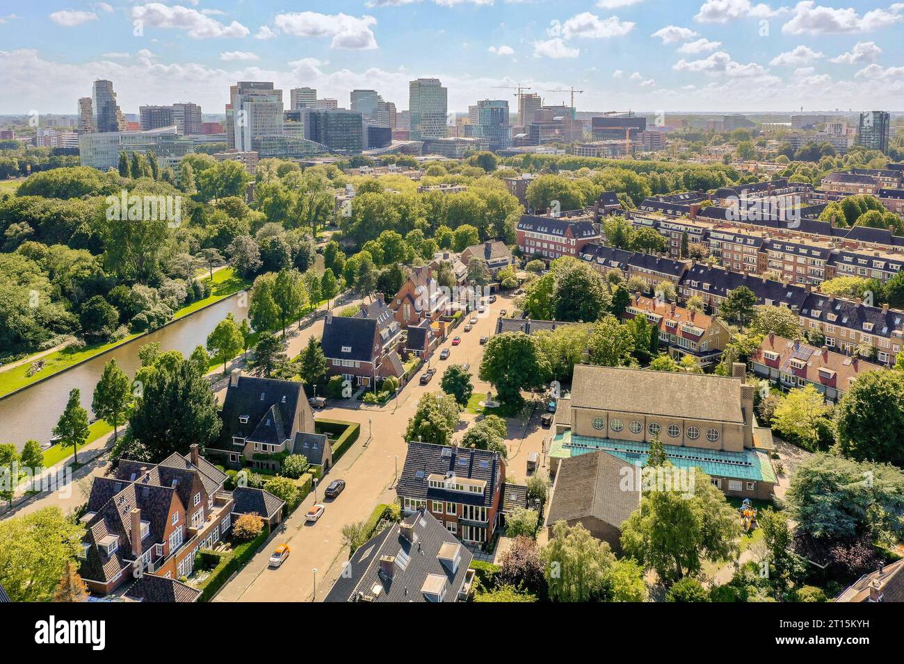 an aerial view of some buildings and trees in the distance, with a ...
