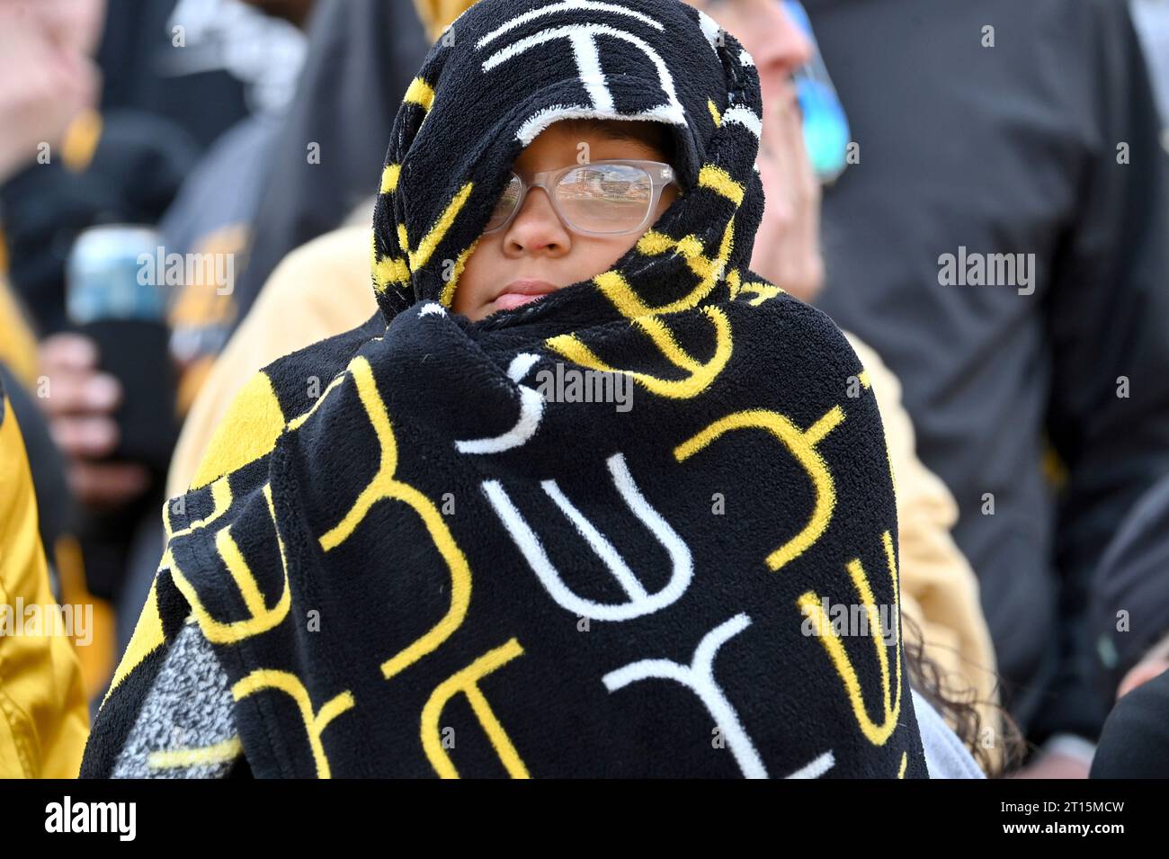 IOWA CITY, IA - OCTOBER 07: An Iowa fan bundles up against the chill ...