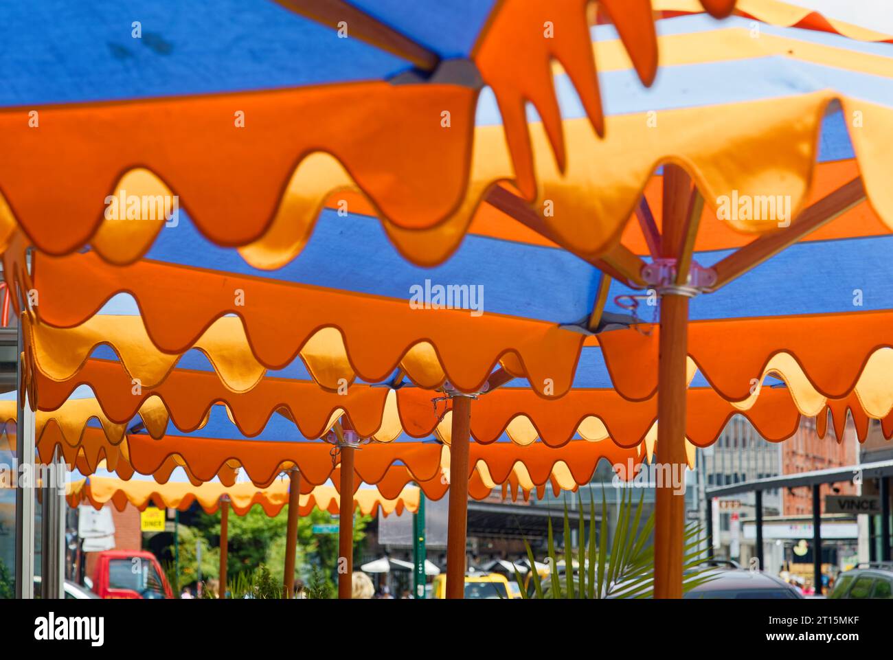 Colorful umbrellas shelter diners at the now-defunct Santina location ...