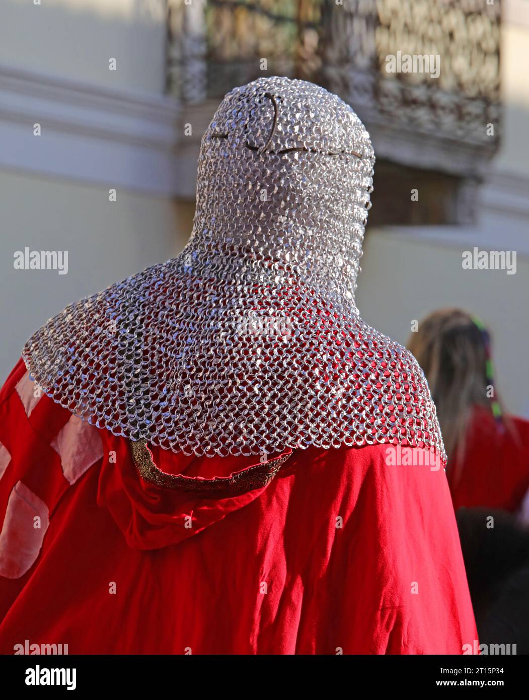 medieval knight with ancient red clothes and metal protection on the ...