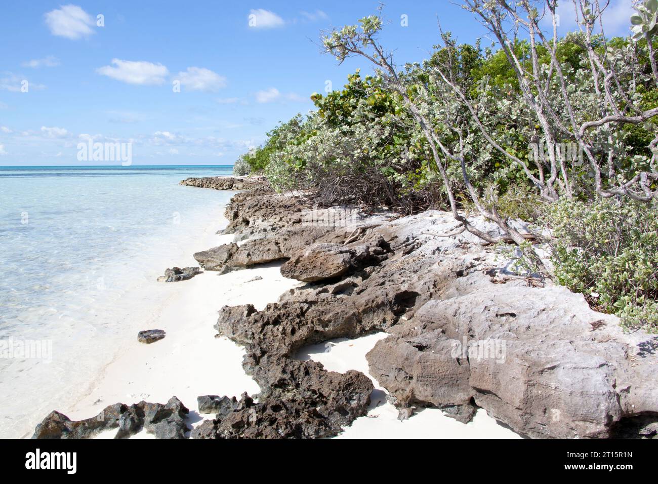 The morning view of narrow rocky beach on Little Stirrup Cay ...