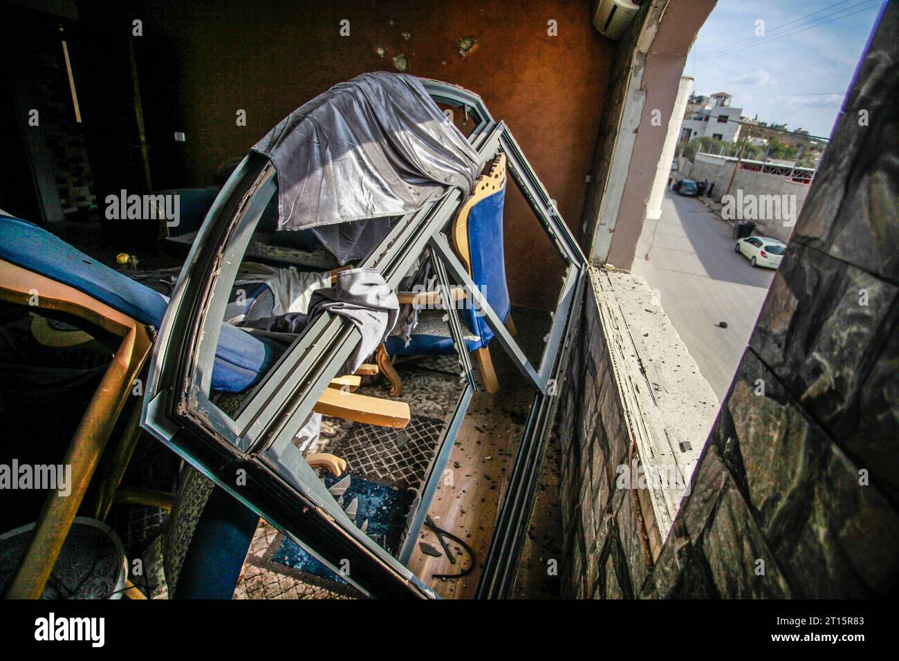 Tulkarm, Palestine. 11th Oct, 2023. View of a house window damaged by ...