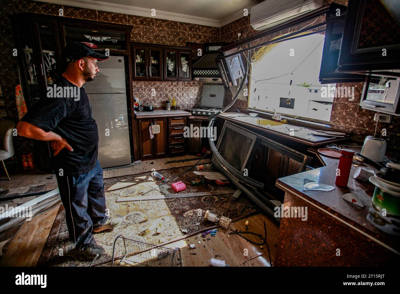 Tulkarm, Palestine. 11th Oct, 2023. A Palestinian inspects his house ...