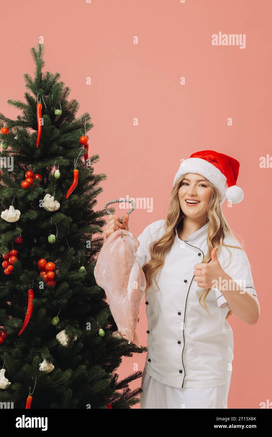 Concept of cooking and Christmas holidays. A beautiful blonde cook in a ...
