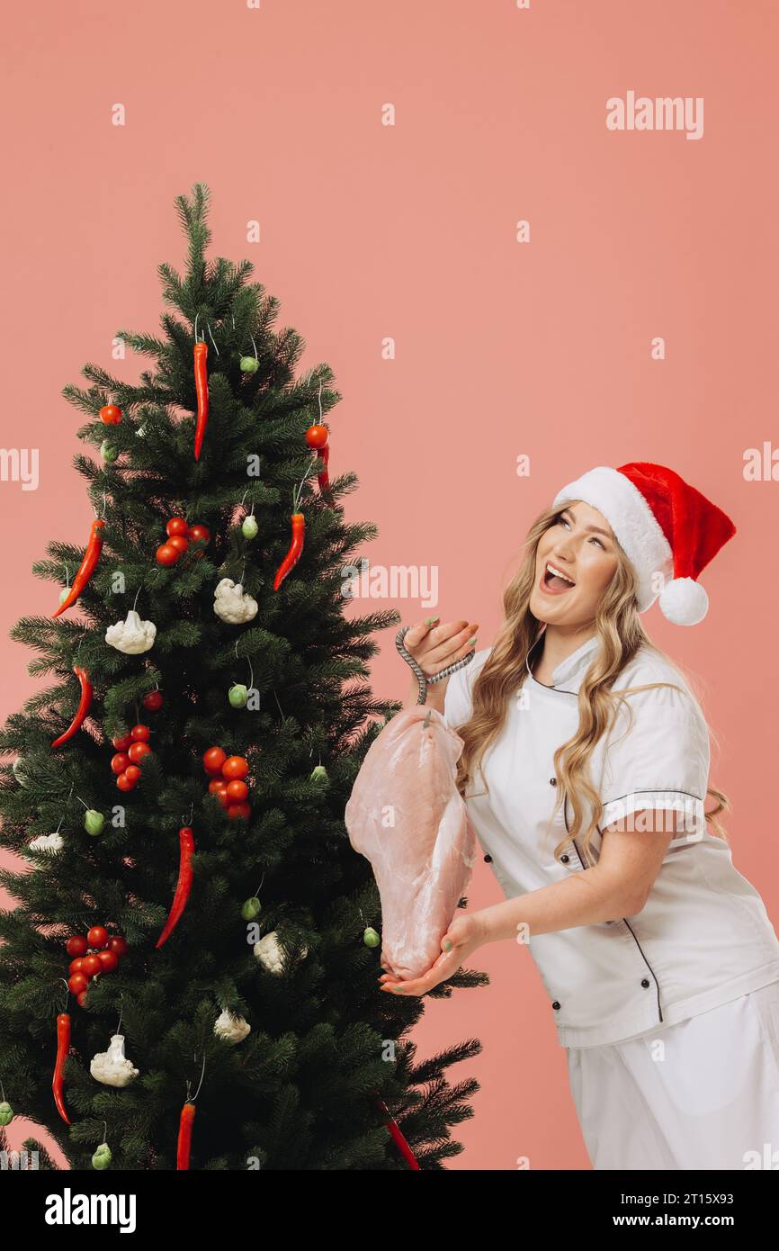 Concept of cooking and Christmas holidays. A beautiful blonde cook in a ...