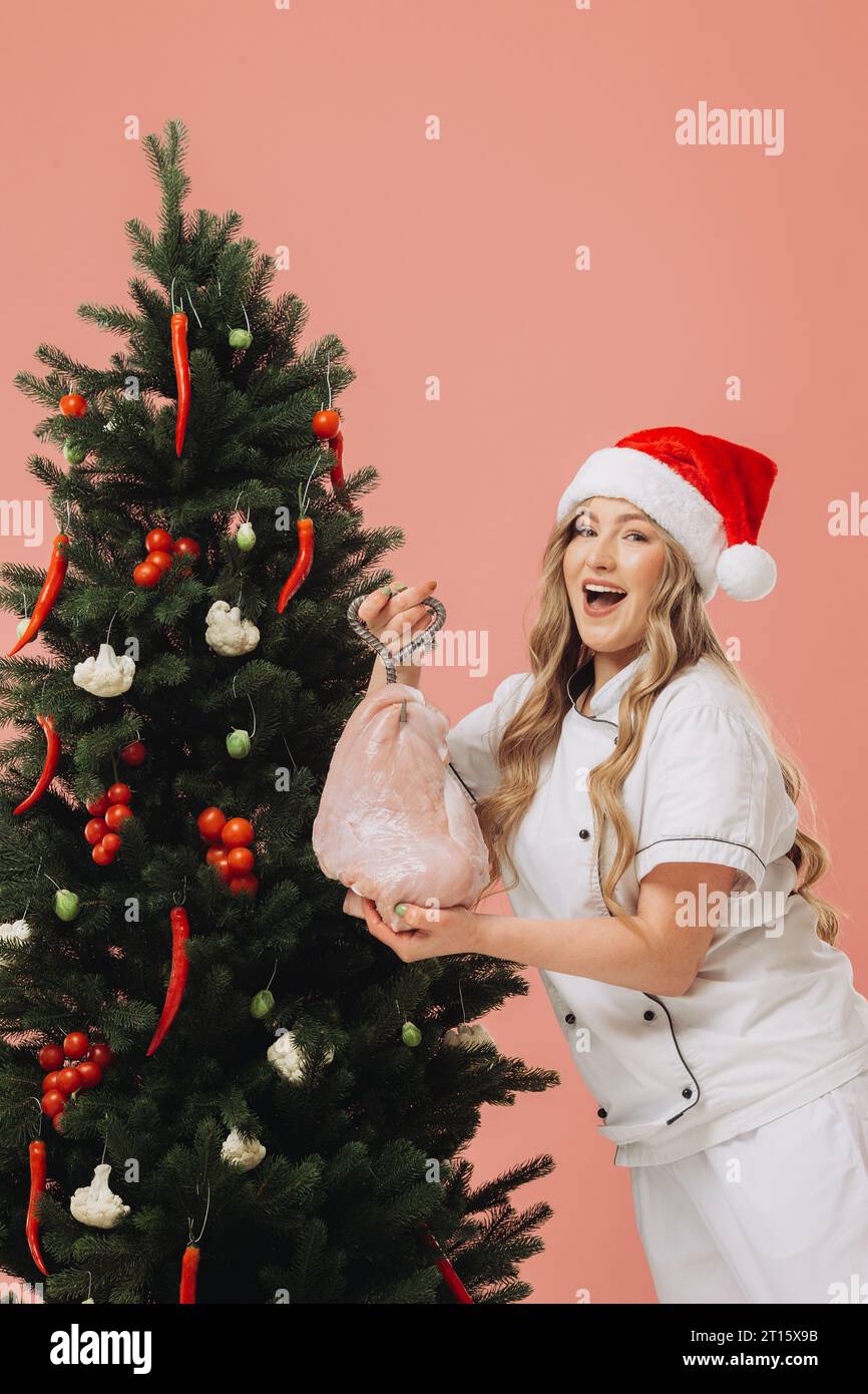 Concept of cooking and Christmas holidays. A beautiful blonde cook in a ...