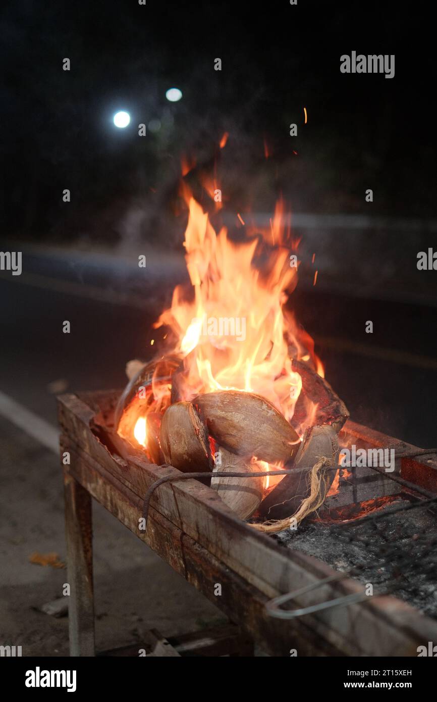 Flaming coconut shells hi-res stock photography and images - Alamy
