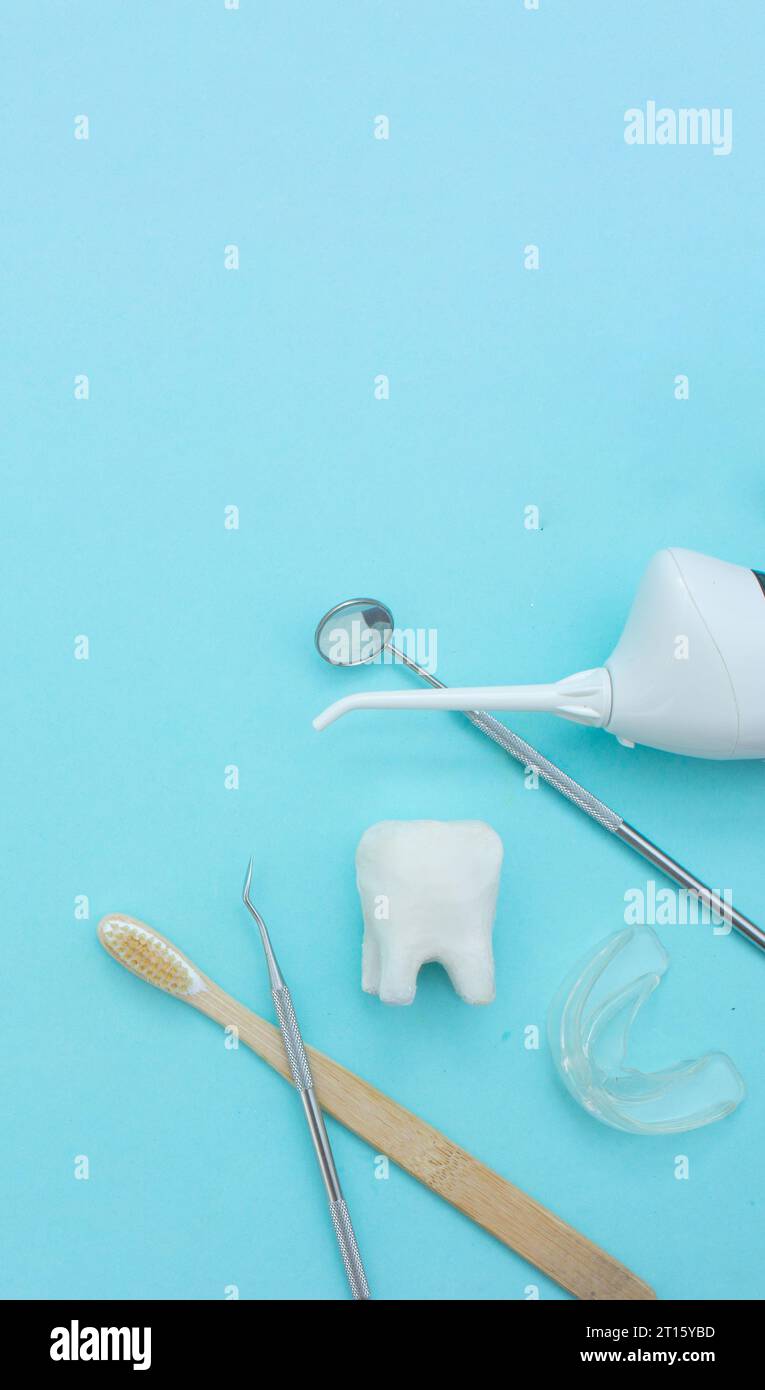 Different tools for dental care, toothbrush, dentist mirror, irrigator ...
