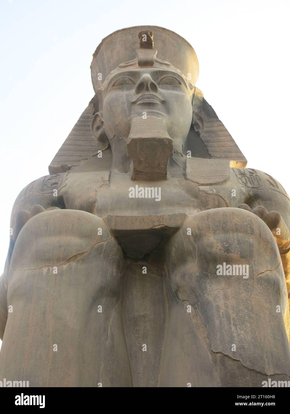 Close-up of the towering statue of Rameses II at the entrance to the ...