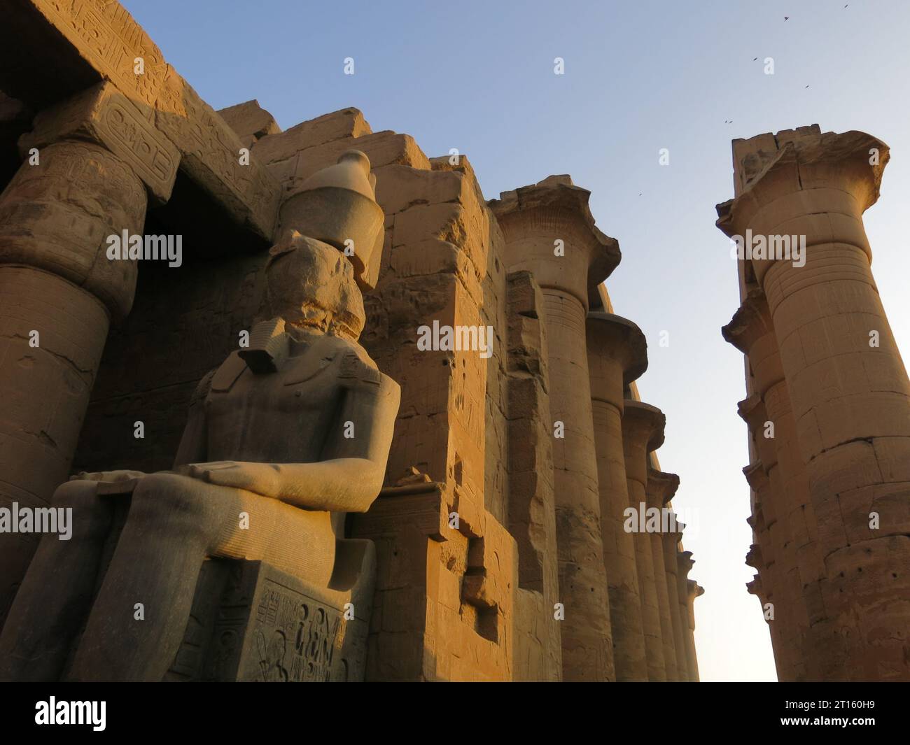 The sandstone of the massive colonnades and statues at the Temple of ...