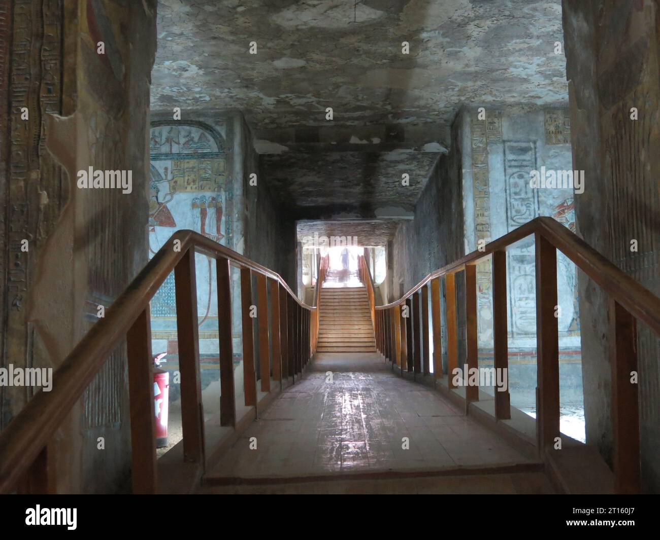 Ancient Egypt: view of the tunnel and steps down into decorated Tomb ...