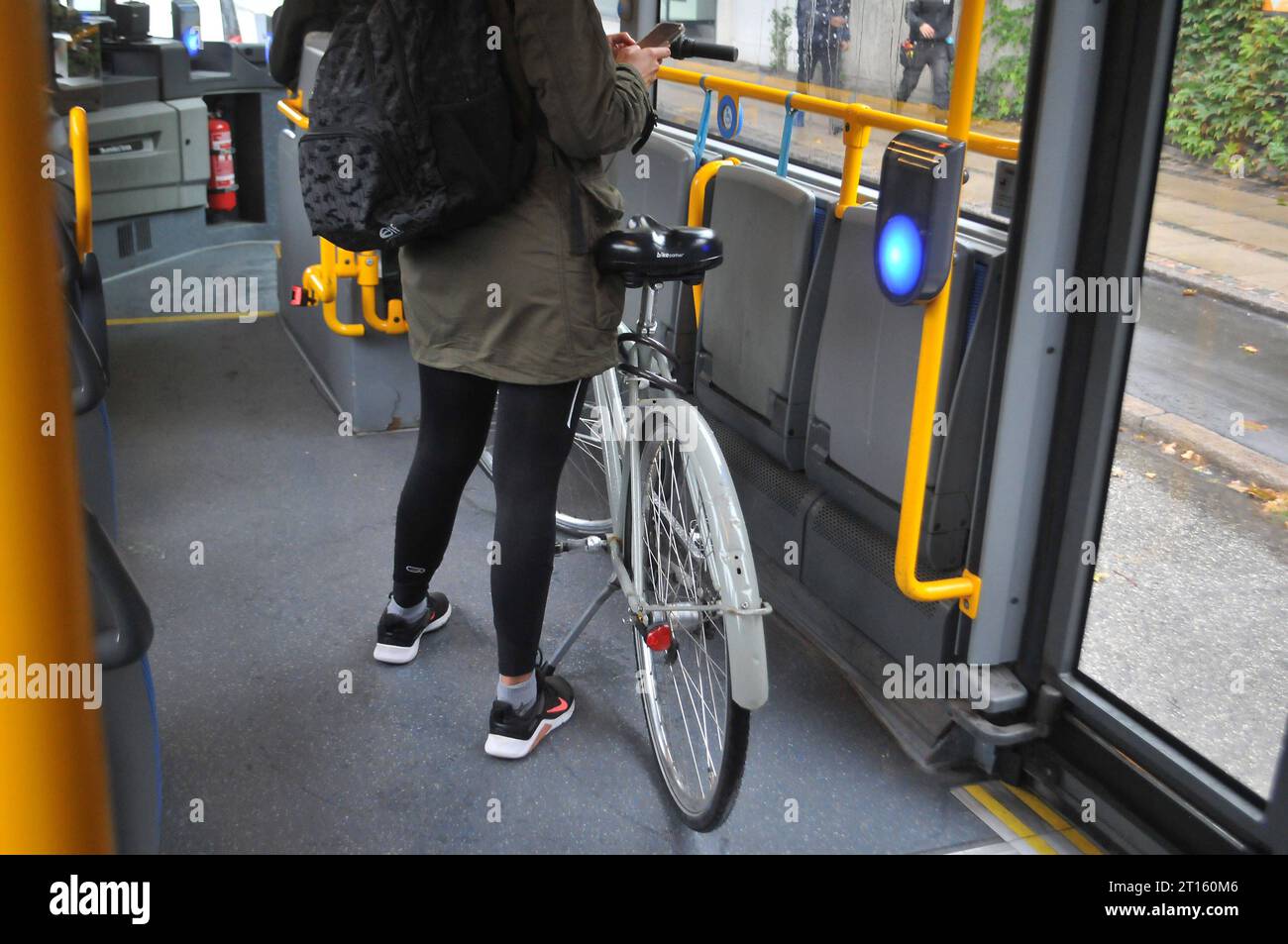 Copenhagen, Denmark /11 October. 2023/.Female transports her bicycle by ...