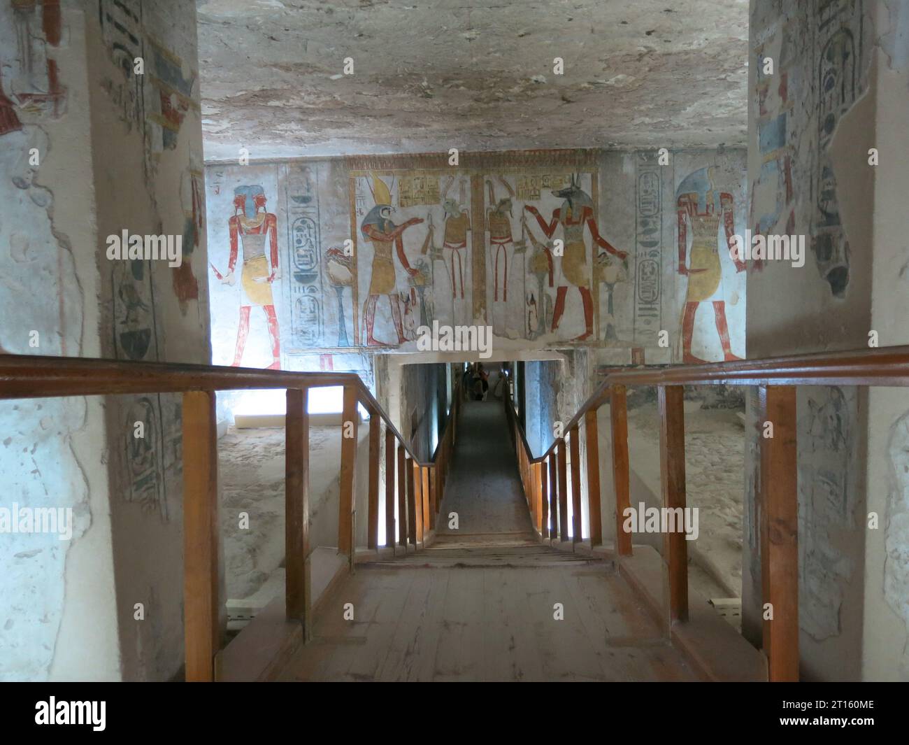 Ancient Egypt: view of the tunnel and steps down into decorated Tomb ...