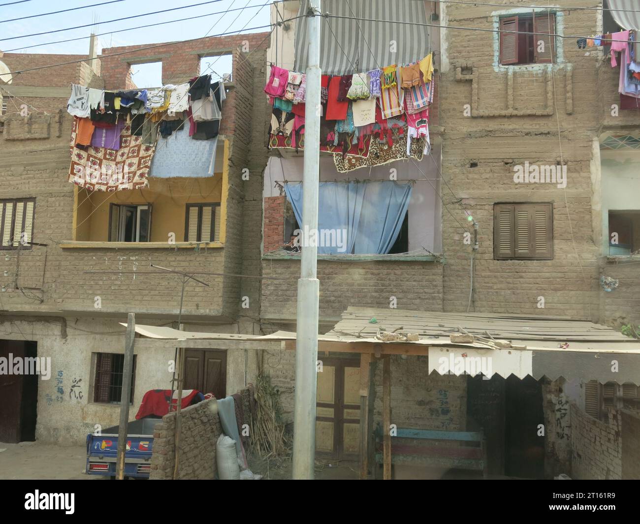 Lines of washing that are strung outside the blocks of flats and ...